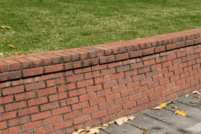 Signs You Need a Retaining Wall Inspection on Leaning Walls