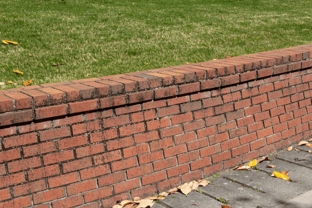 Signs You Need a Retaining Wall Inspection on Leaning Walls