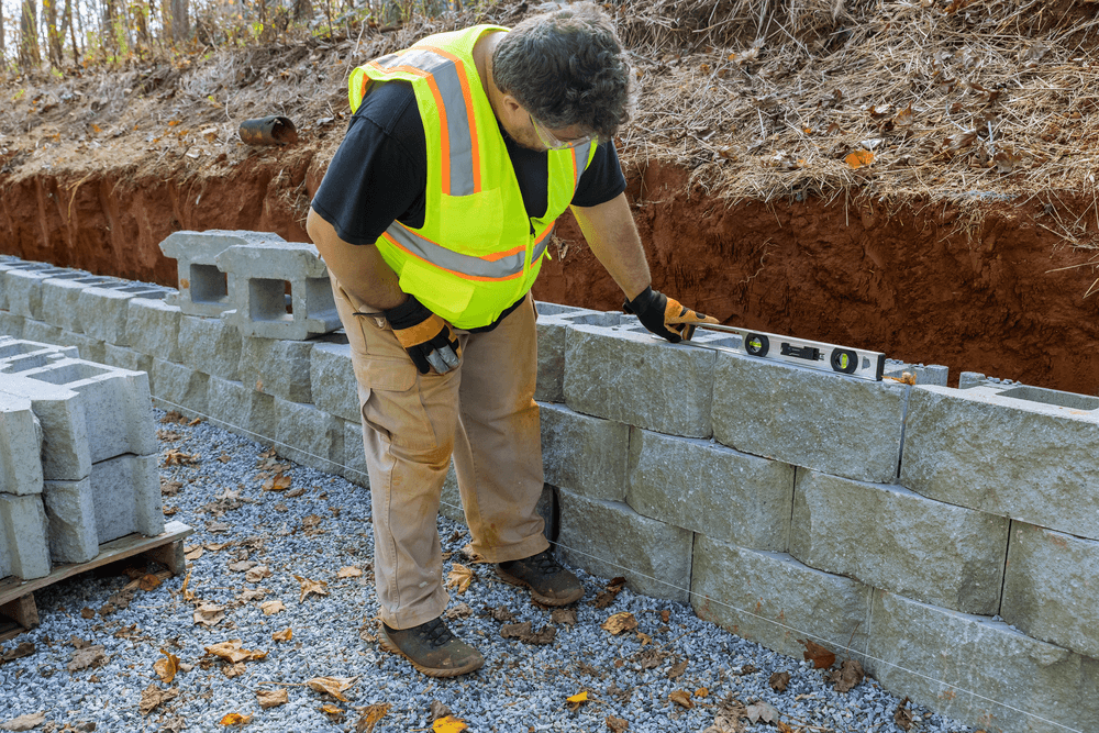 Signs You Need a Retaining Wall Inspection on Leaning Walls